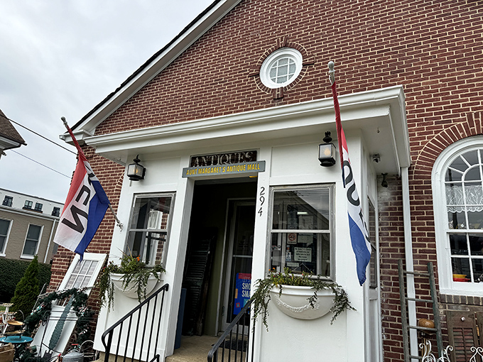 The charming brick exterior of Aunt Margaret's beckons with its round window and vintage lanterns&mdash;like a time portal disguised as a building.
