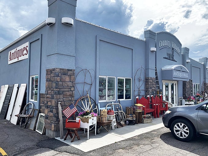 The unassuming exterior of Country Village Antique Mall belies the wonderland within, like a time-travel portal disguised as a suburban building.