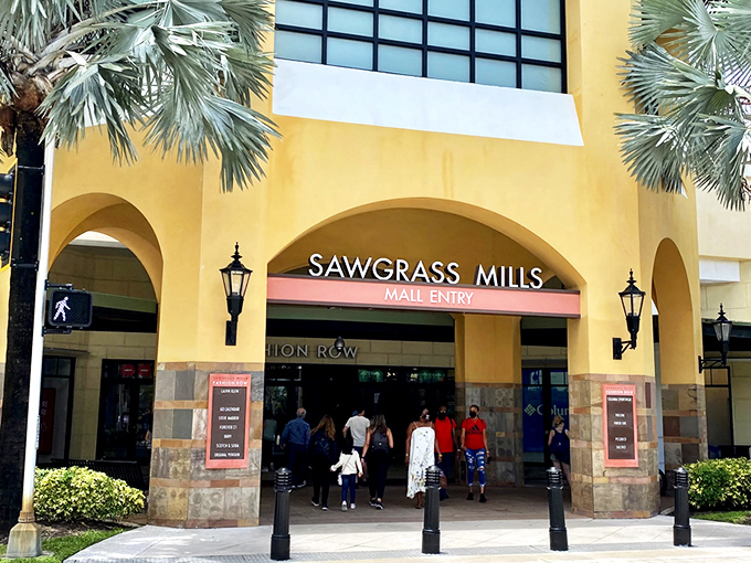 Palm trees frame the entrance to Sawgrass Mills like nature's own welcome committee. Florida shopping doesn't get more iconic than this retail oasis.
