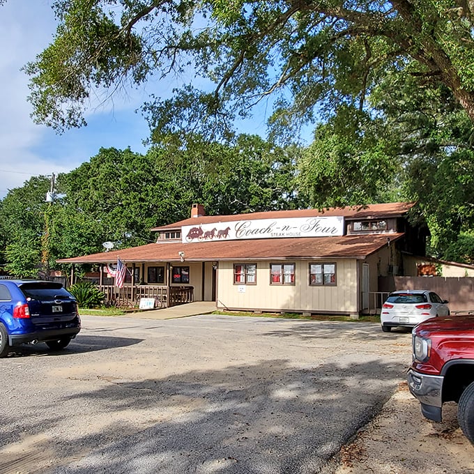 The unassuming exterior of Coach-n-Four Steakhouse stands as a time capsule of old Florida dining, where steak legends are born beneath towering pines.