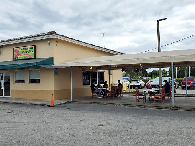 The unassuming exterior of Taqueria Morelia stands like a culinary speakeasy in Florida City, promising authentic flavors behind its modest fa&ccedil;ade.
