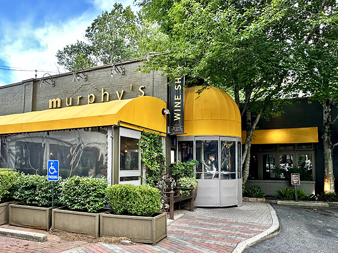 Murphy's signature yellow awning stands like a beacon of culinary delight in Atlanta's Virginia-Highland neighborhood, promising comfort and indulgence just beyond those doors.