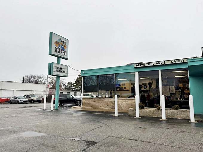 The turquoise beacon of Steer-In stands proudly against an Indiana sky, promising comfort food salvation to hungry Indianapolis souls.