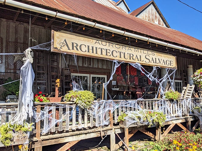 The rustic barn exterior of Aurora Mills beckons like a siren song to vintage lovers. Halloween cobwebs add seasonal charm to this already magical treasure trove.