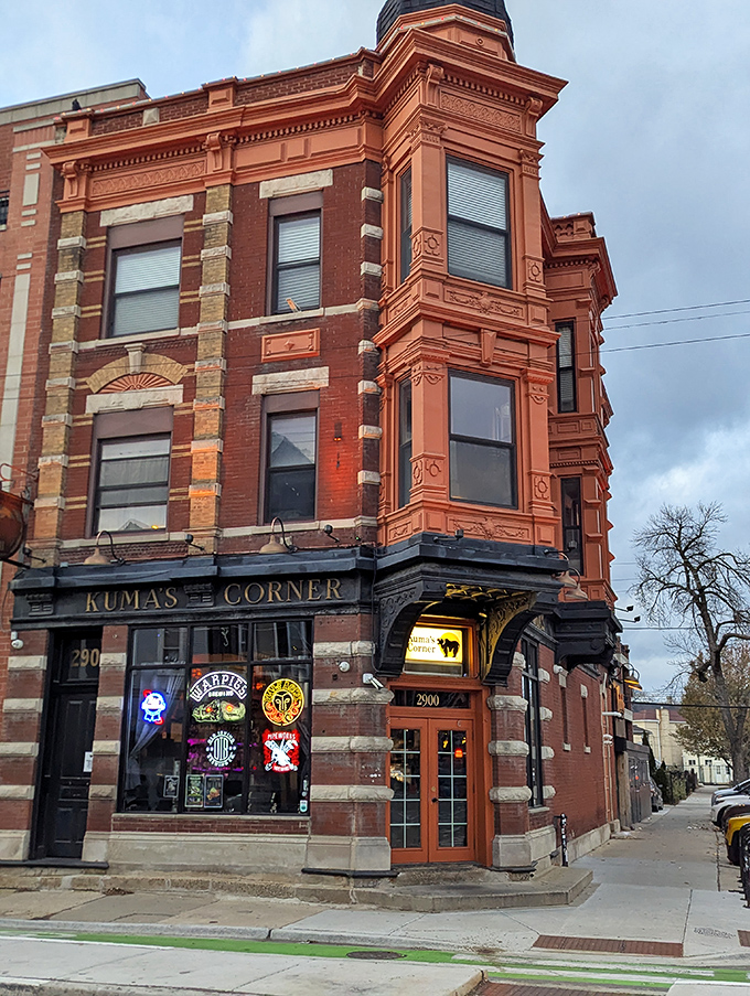 Kuma's Corner stands proudly at Belmont Avenue, its vintage brick exterior and metal band logos promising a burger experience that's anything but ordinary.