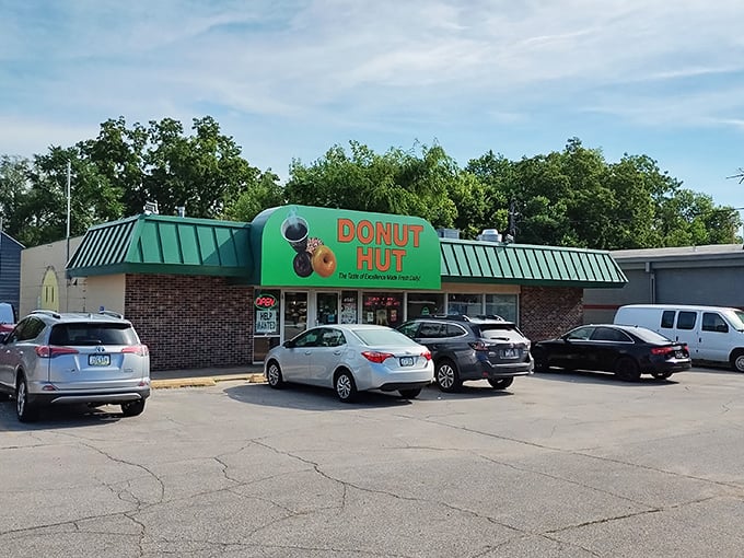 The green awning beckons like a sugar-coated lighthouse in a sea of ordinary breakfasts. Des Moines' morning pilgrimage spot doesn't need fancy signage when the donuts speak volumes.