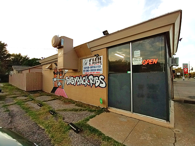 The unassuming exterior of Fish & More might not scream "culinary destination," but locals know true seafood treasures await behind that neon "OPEN" sign.