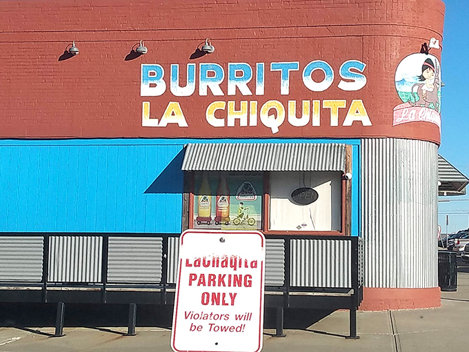 The bright blue entrance against brick-red walls isn't just eye-catching&mdash;it's a beacon for burrito lovers across Kansas City. No fancy frills, just fantastic food awaiting inside. 
