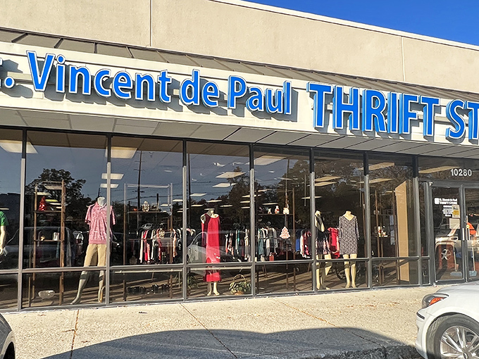 The blue signage of St. Vincent de Paul beckons like a thrift store lighthouse, promising treasures within those glass doors.