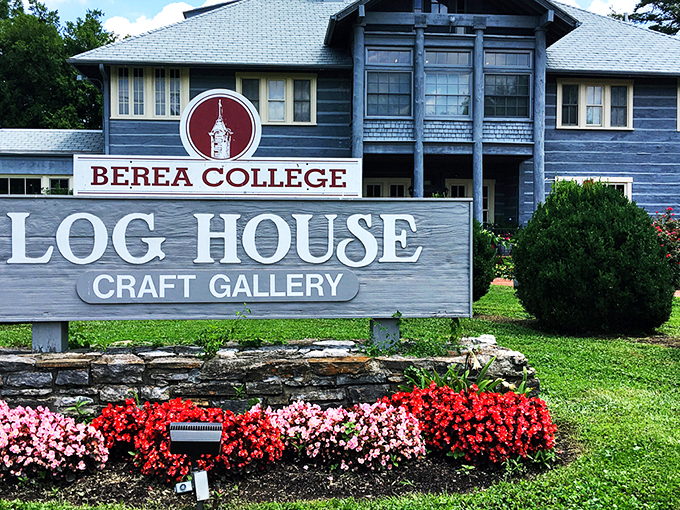 The stately blue Log House Craft Gallery stands like a guardian of Appalachian tradition, proudly displaying its Berea College heritage beneath Kentucky's endless sky.