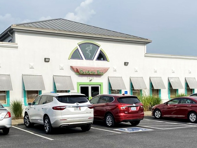 The turquoise planters standing guard at Flamingo Row's entrance are like tropical sentinels, welcoming you to this Kentucky-meets-Caribbean oasis in Paducah.