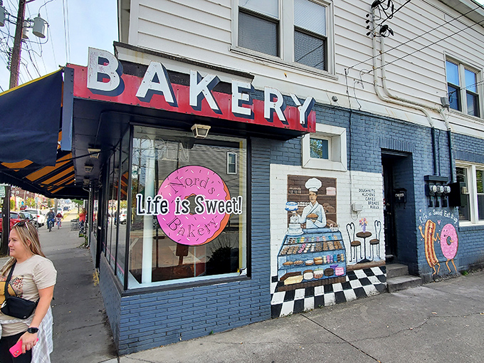 The blue storefront with its cheerful pink logo promises sweet salvation. Nord's Bakery stands as Louisville's temple of temptation, where calories don't count and joy is guaranteed.