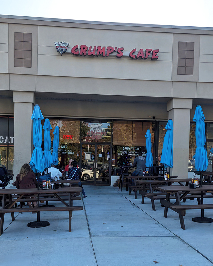 The unassuming strip mall exterior of Grump's Cafe proves once again that the best breakfast joints often hide in plain sight. Those blue umbrellas are practically waving you in!
