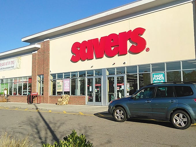 The iconic red Savers sign beckons like a lighthouse for bargain hunters, promising treasures waiting just beyond those sliding glass doors.