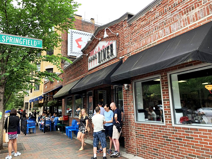 The brick fa&ccedil;ade of Mike's City Diner stands like a beacon of breakfast hope on Washington Street, promising culinary salvation to hungry Bostonians.