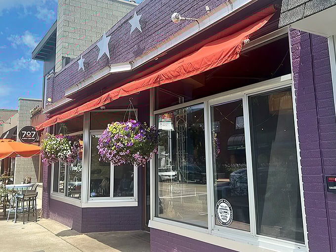 The purple facade with its cheerful red awning and hanging flower baskets isn't just eye-catching&mdash;it's nature's way of saying "breakfast is served!"
