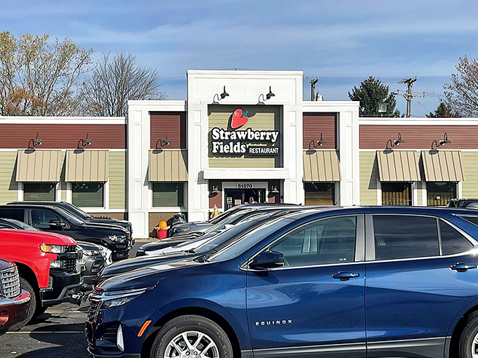 The white facade with its cheerful strawberry logo promises comfort food with a side of Beatles nostalgia. A culinary Yellow Submarine awaits!