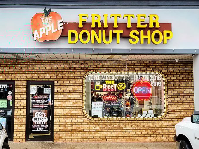 The yellow block letters against brick might not scream "culinary destination," but locals know this humble storefront houses donut royalty.