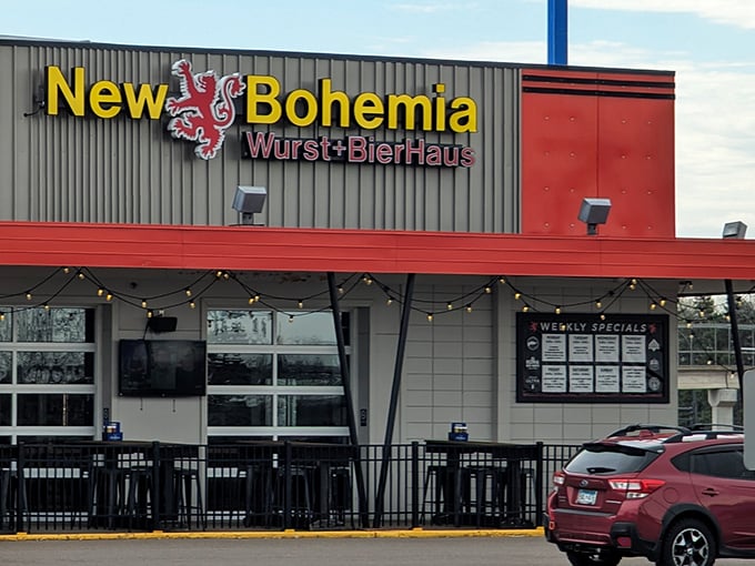 The golden lion on New Bohemia's sign stands guard like a medieval sentinel, promising Bavarian delights within those red-trimmed walls.