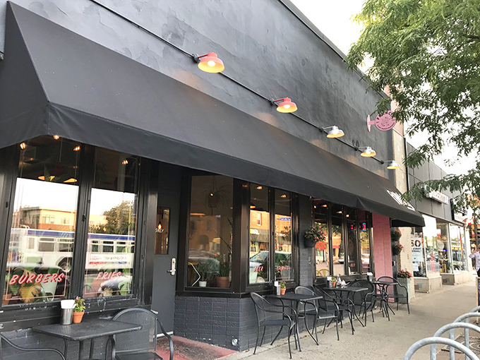 Francis Burger Joint's sleek black exterior beckons hungry passersby with its minimalist charm and promise of burger perfection ahead.