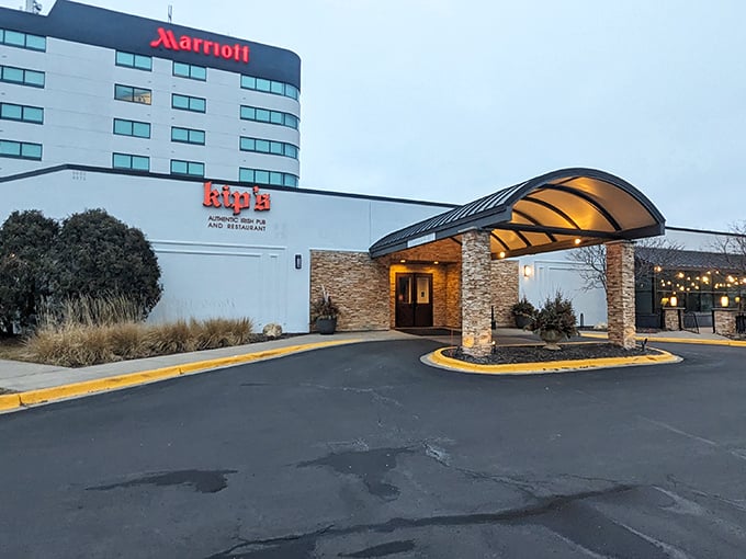The welcoming stone entrance of Kip's Irish Pub stands ready to rescue you from Minnesota winters with its promise of warmth and hearty fare inside.