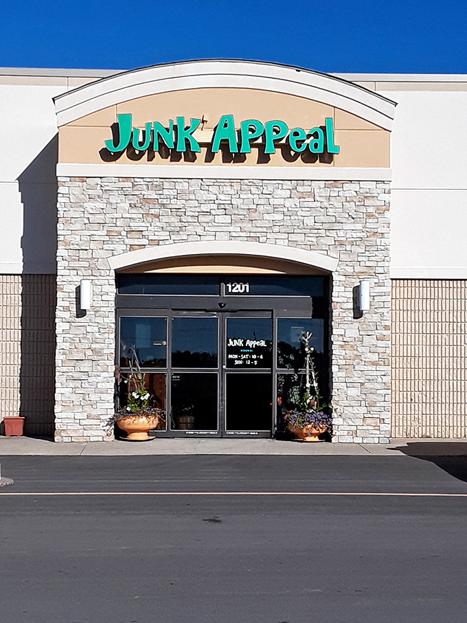The turquoise sign of Junk Appeal beckons like a siren call to bargain hunters. Behind that stone facade lies a wonderland of treasures waiting to be discovered.