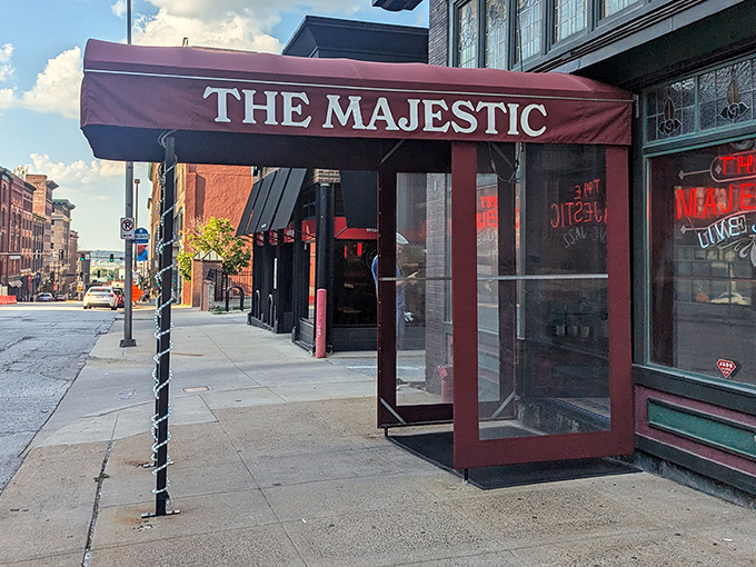 The crimson awning of The Majestic beckons like a time portal to the Prohibition era. History and hunger, satisfied under one historic roof.