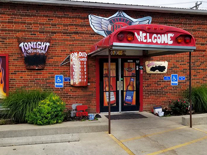 The entrance says it all: repurposed school bus meets flame-adorned brick wall. Barbecue paradise doesn't need fancy signage when the aroma does the talking.