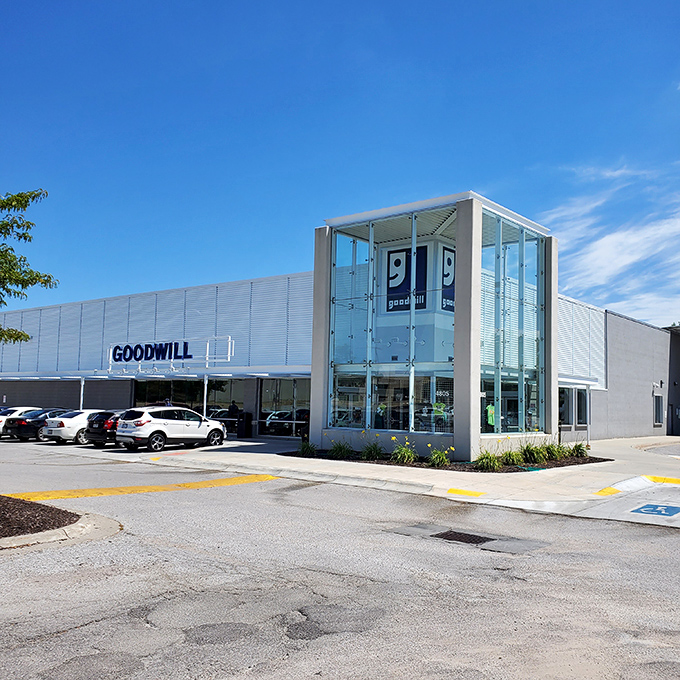 The modern exterior of Goodwill on 72nd Street beckons like a department store, but inside awaits a treasure hunt where every purchase helps the community.