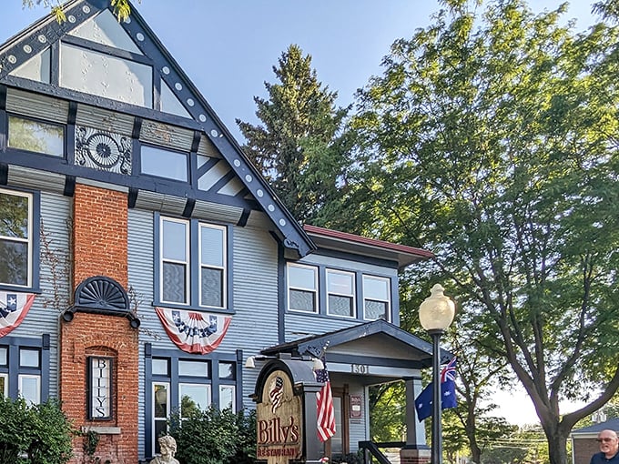 Billy's blue Victorian exterior isn't just charming&mdash;it's a culinary time machine disguised as your fancy aunt's house. The patriotic bunting adds a perfect touch.