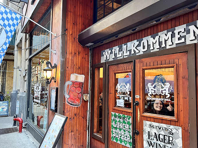 The wooden facade of Reichenbach Hall beckons with its "WILLKOMM" sign, like a warm German hug in the middle of Manhattan's concrete jungle.