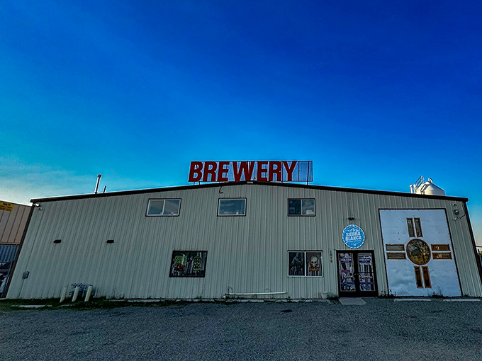 The ultimate "don't judge a book by its cover" moment. This unassuming metal building houses liquid gold under that brilliant New Mexico sky.