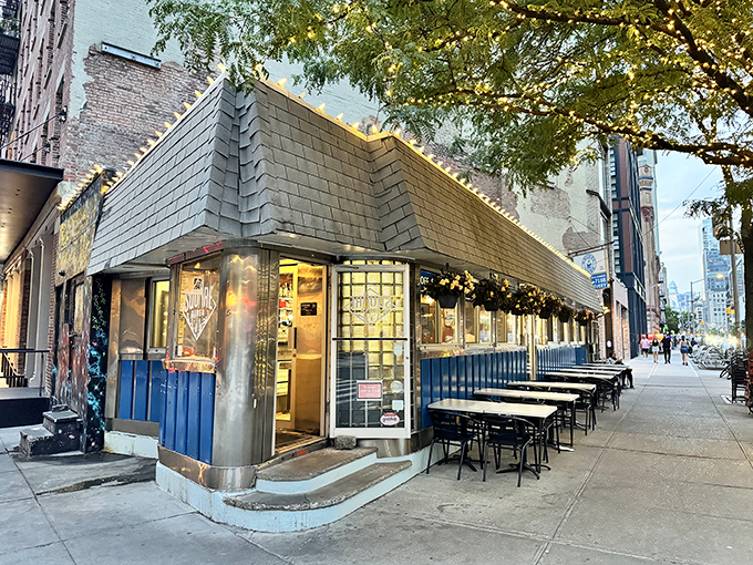 The iconic blue panels and stainless steel trim of Square Diner stand defiant against Tribeca's modernization, like your favorite uncle who refuses to upgrade his flip phone.