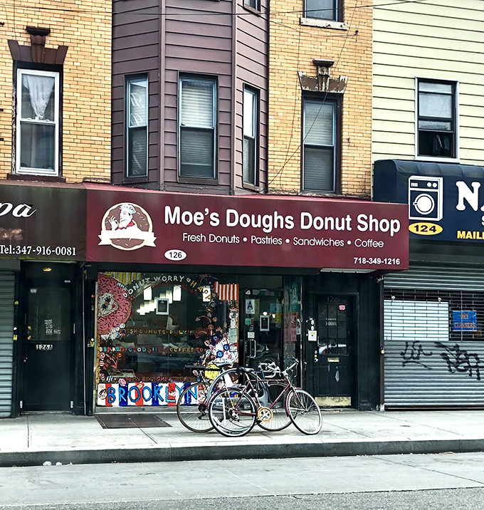 The unassuming burgundy awning of Moe's Doughs stands as Brooklyn's sweetest secret hiding in plain sight, complete with vintage charm and bicycles parked hopefully nearby.
