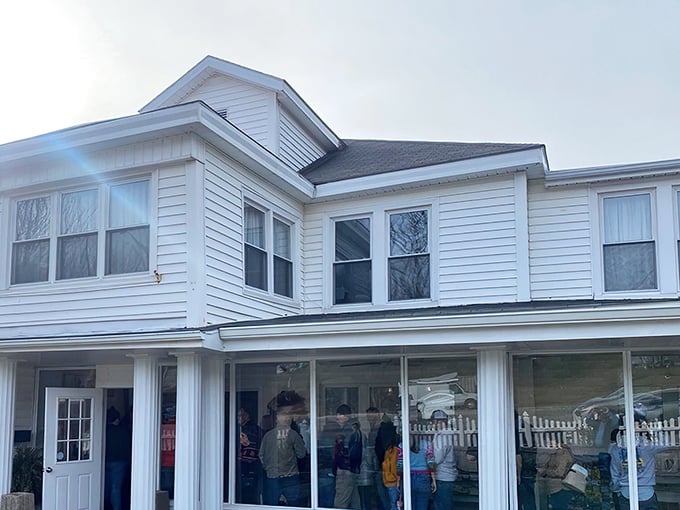 The white clapboard exterior with its American flag announces itself without pretense&mdash;like that reliable friend who never changes but always delivers the goods.