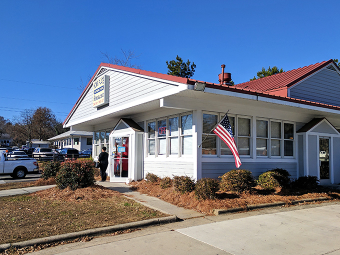 The modest white exterior with its simple sign says everything you need to know: no gimmicks, just honest Southern cooking that keeps locals coming back.
