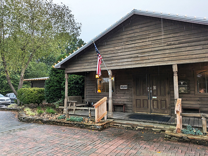 Rustic charm meets carnivore's paradise at this unassuming wooden cabin. The brick pathway practically whispers, "Follow me to steak nirvana."