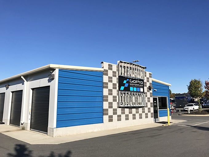 The sprawling track stretches before you like a ribbon of possibility, where everyday drivers transform into racing legends for an afternoon.