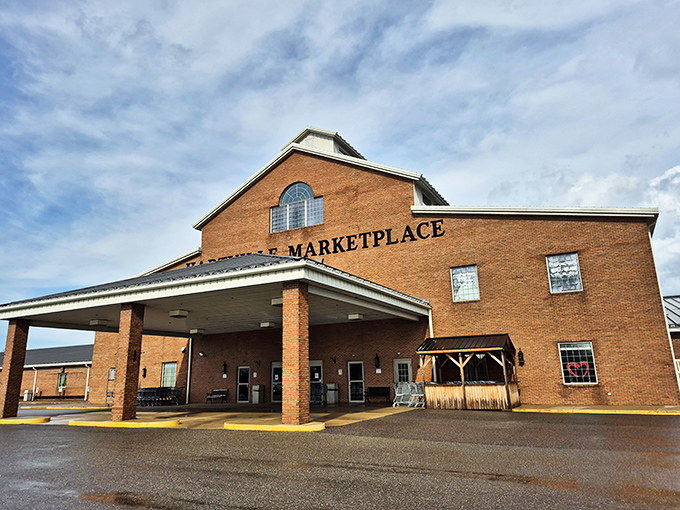 The brick facade of Hartville MarketPlace stands like a retail cathedral, promising treasures within. Even the parking lot buzzes with anticipation.