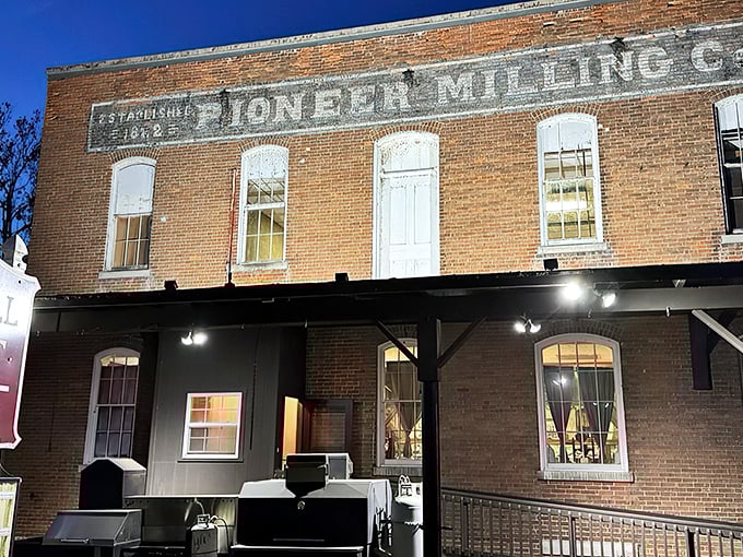 History you can taste! The iconic brick exterior of Pioneer Mill stands as a delicious time capsule in Tiffin, where flour-making heritage meets modern culinary magic.