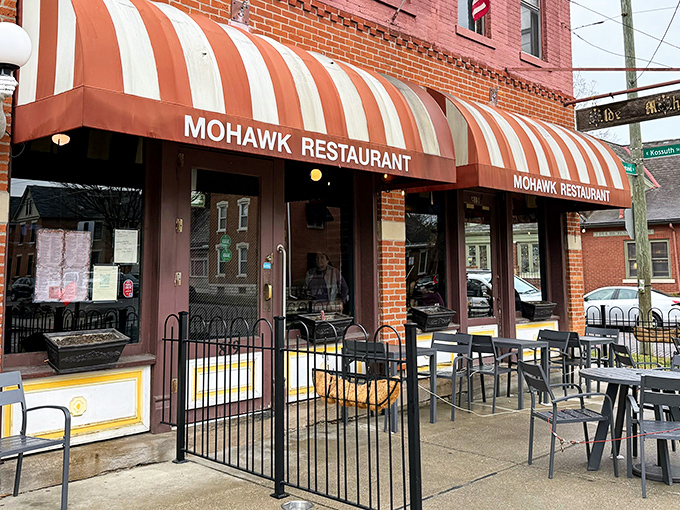 The iconic red and white striped awning of The Old Mohawk beckons like a culinary lighthouse in Columbus's charming German Village. Resistance is futile.