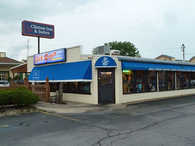The iconic blue awning of Jolly Roger Seafood House stands as a beacon for seafood pilgrims. Like a coastal mirage in Port Clinton, it promises treasures from the deep.