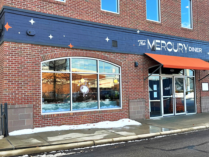 The Mercury Diner's navy blue facade with bright orange awning isn't just inviting&mdash;it's practically a bat signal for hungry Ohioans seeking comfort food nirvana.