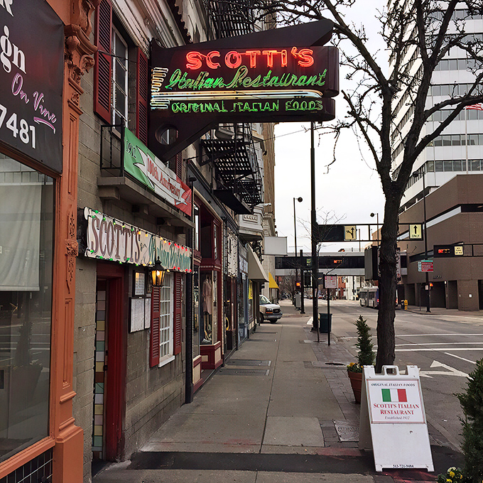 The iconic red and green neon sign beckons hungry Cincinnatians like a lighthouse for pasta-seeking souls. Scotti's modest storefront hides culinary treasures within.