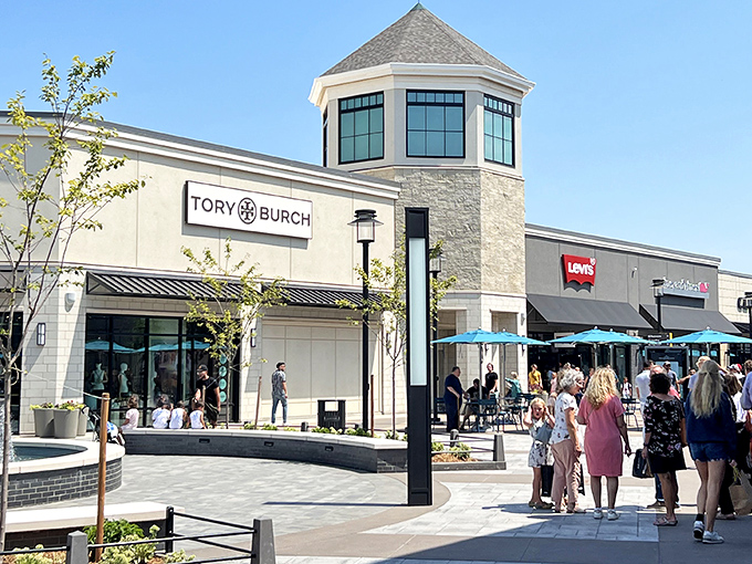 The modern façade of Tulsa Premium Outlets welcomes bargain hunters with its clean lines and inviting walkways—retail therapy's promised land in Jenks.