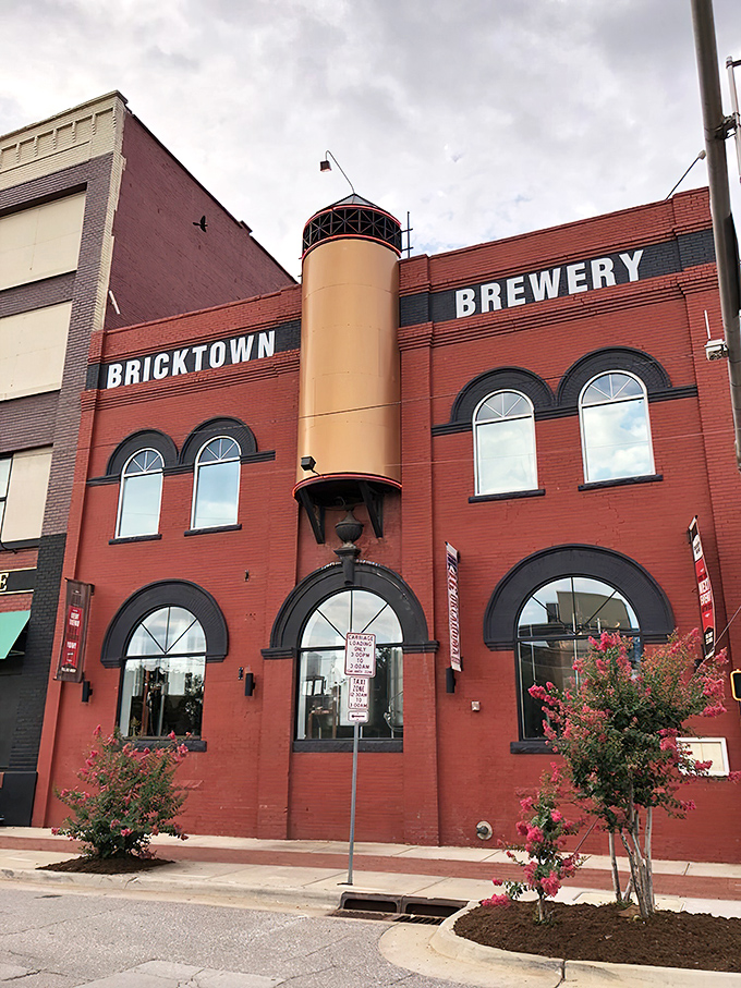 The iconic red brick exterior of Bricktown Brewery stands as a beacon of culinary promise in Oklahoma City's historic district, where industrial charm meets modern appetite.
