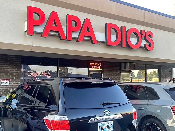 The glowing red sign beckons like a lighthouse for the pasta-starved. No fancy frills, just the promise of authentic Italian goodness waiting inside.