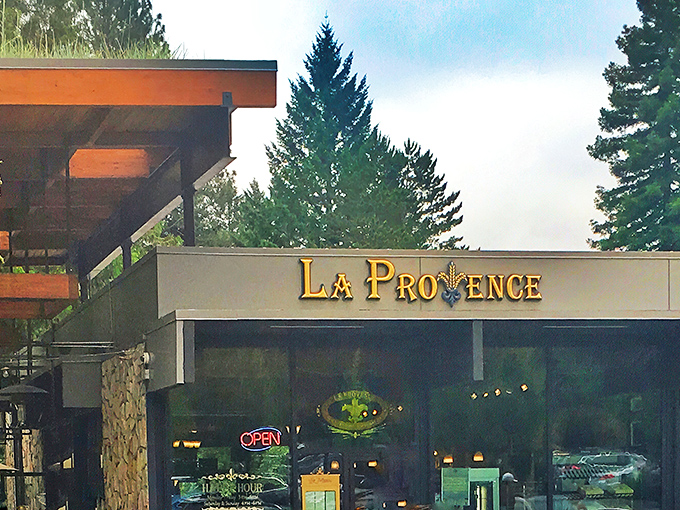 La Provence glows like a beacon of French culinary promise at dusk, its warm lights beckoning hungry Oregonians from miles around. 