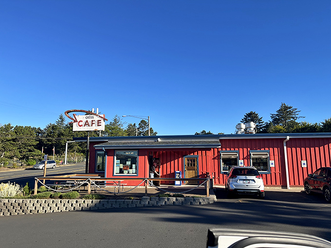 The iconic red exterior of Otis Caf&eacute; stands like a beacon for hungry travelers on Highway 18, promising comfort food salvation just minutes from the Oregon coast. 