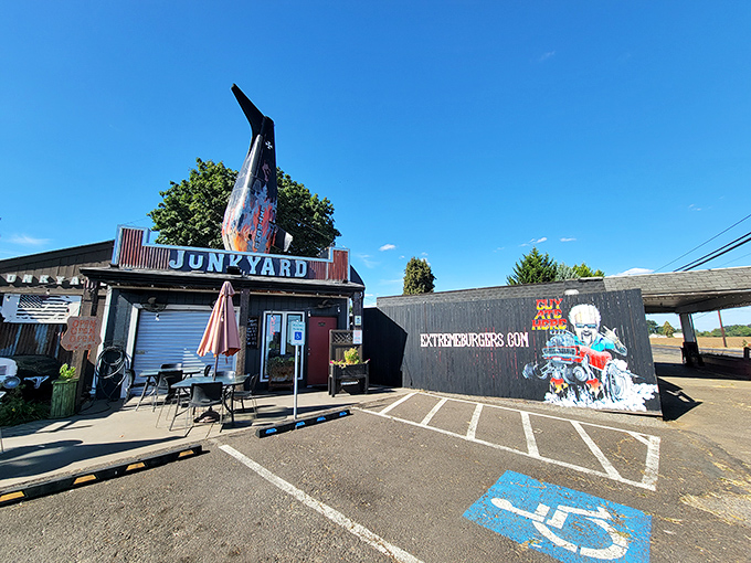 The ultimate roadside treasure hunt ends here! Junkyard's exterior promises automotive nostalgia and burger bliss under Oregon skies.